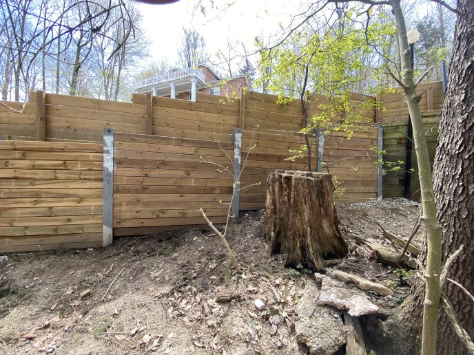 Wood retaining wall on a slope - JW Portable Welding & Repairs